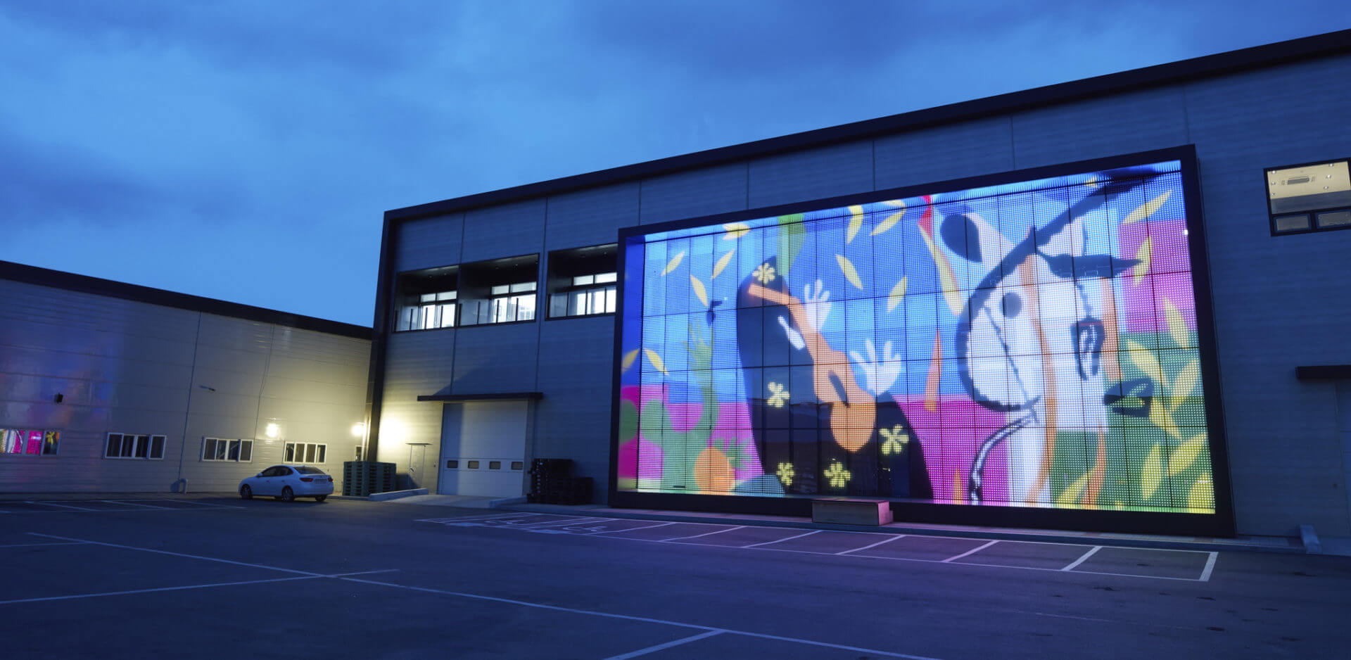 Transparent LED Glass Media Facade - GLAAM America